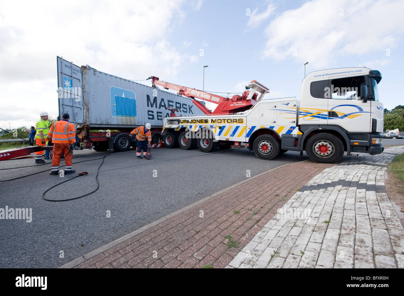 Overturned lorry being rescued by a rescue truck in Leicestershire ...