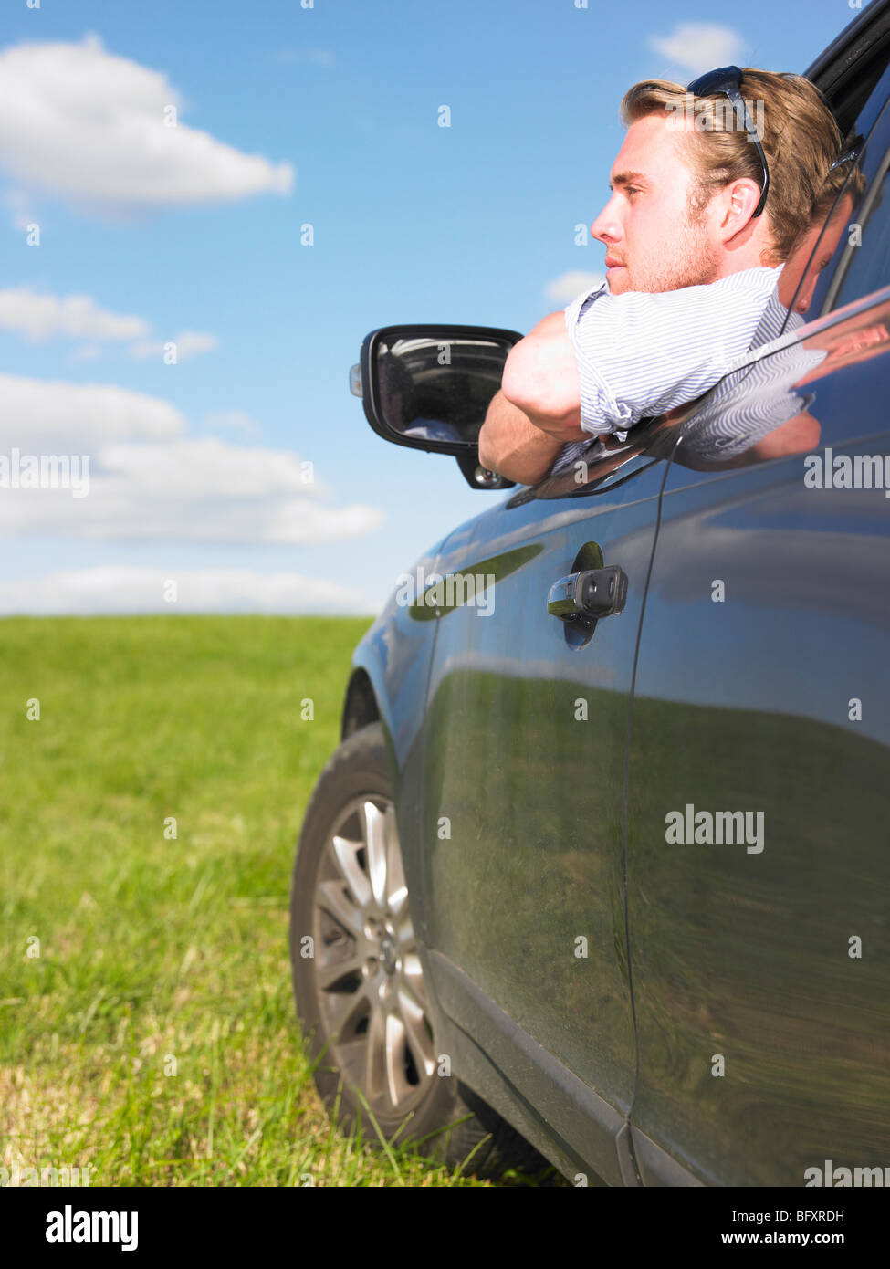 man looking out of car window Stock Photo - Alamy