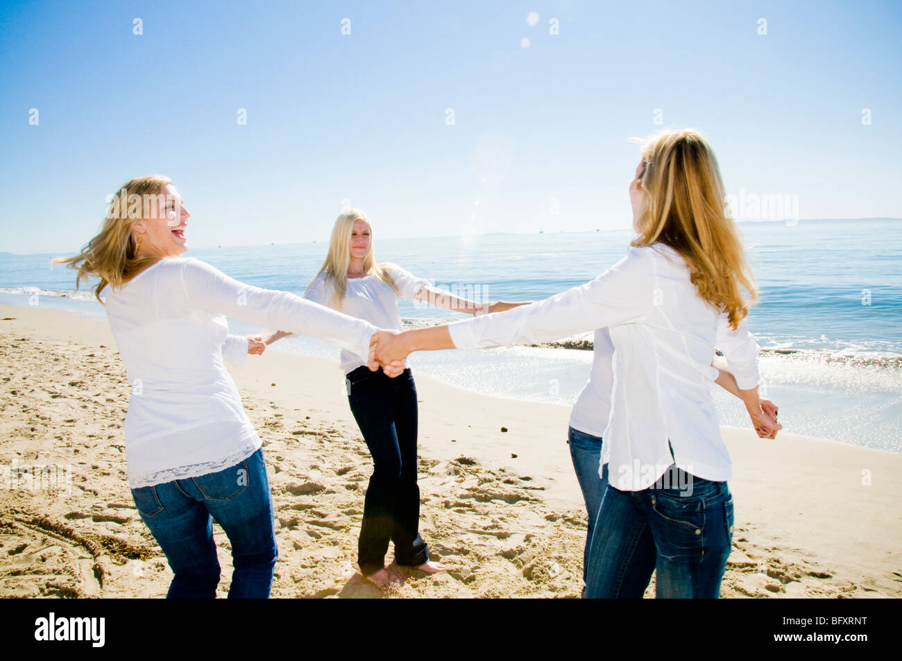 Women circle beach hi-res stock photography and images - Alamy