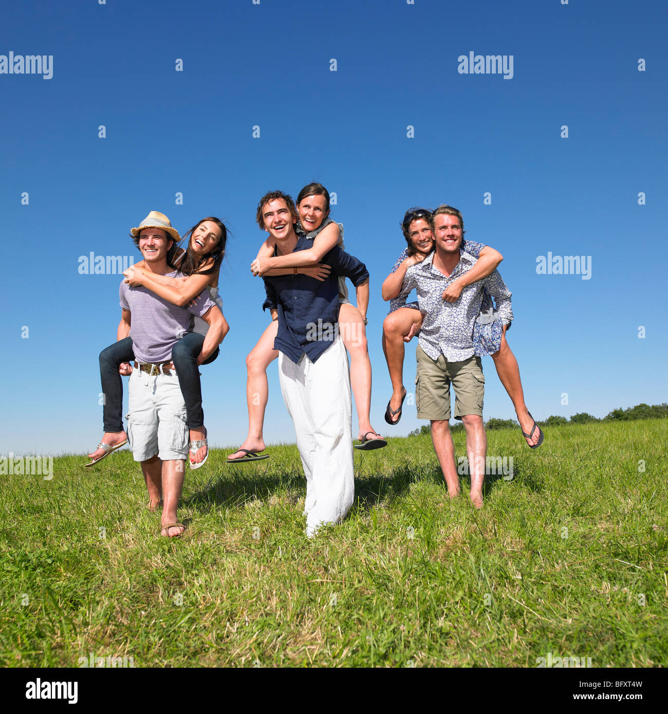 Woman riding piggyback hi-res stock photography and images - Alamy