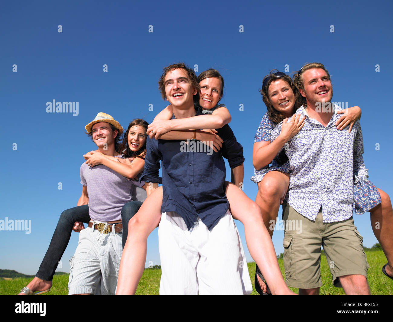 Young Woman Riding Piggyback Friend Stock Photos & Young Woman Riding ...