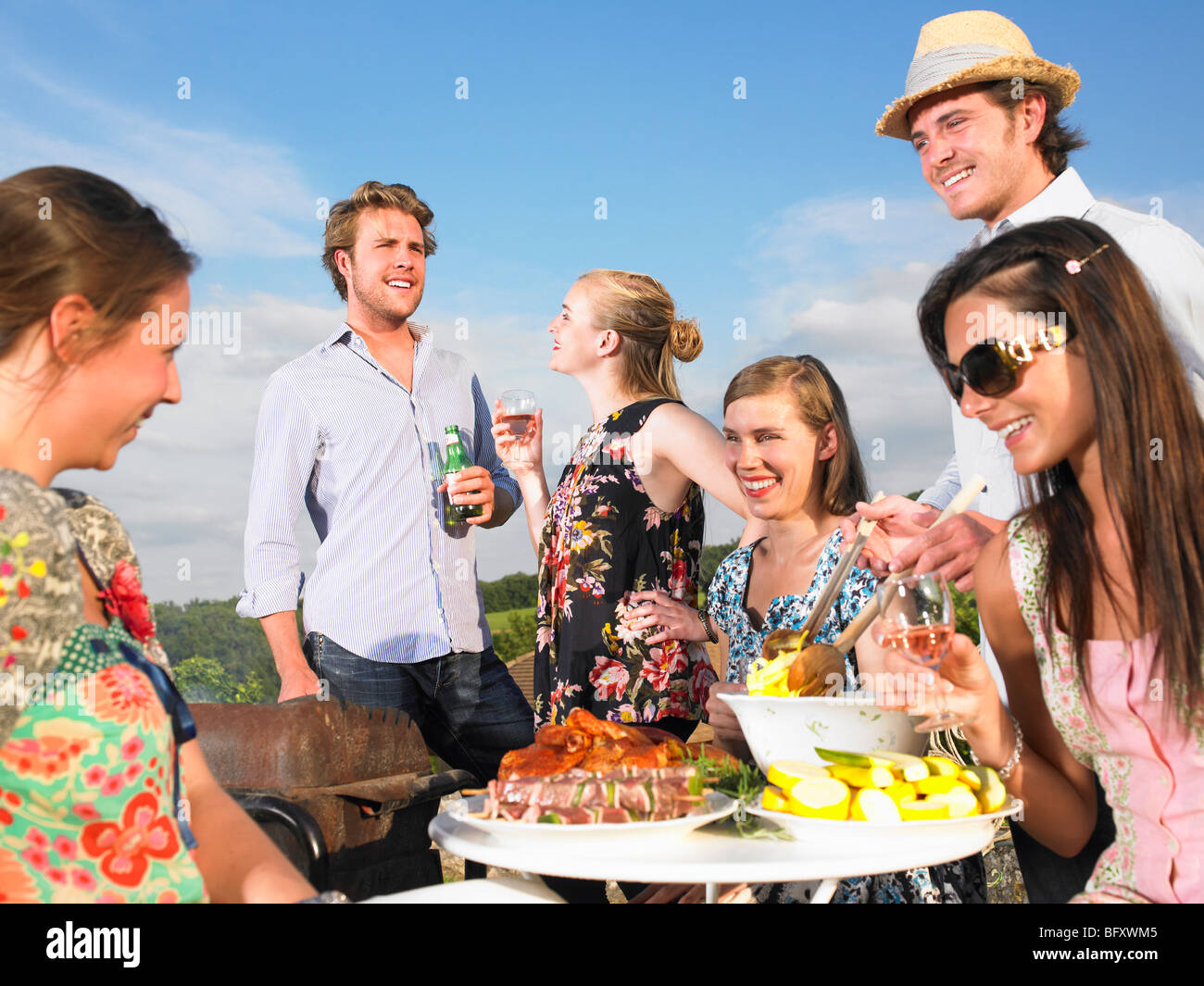 young people having barbecue Stock Photo - Alamy