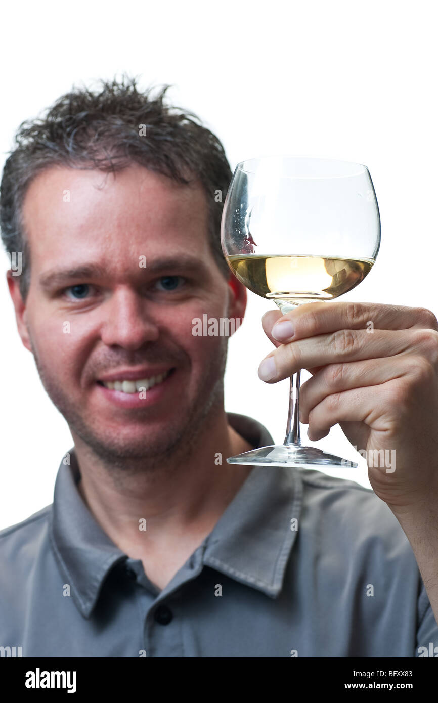 A man holding a wine glass up, making a toast, focus on the wine glass ...