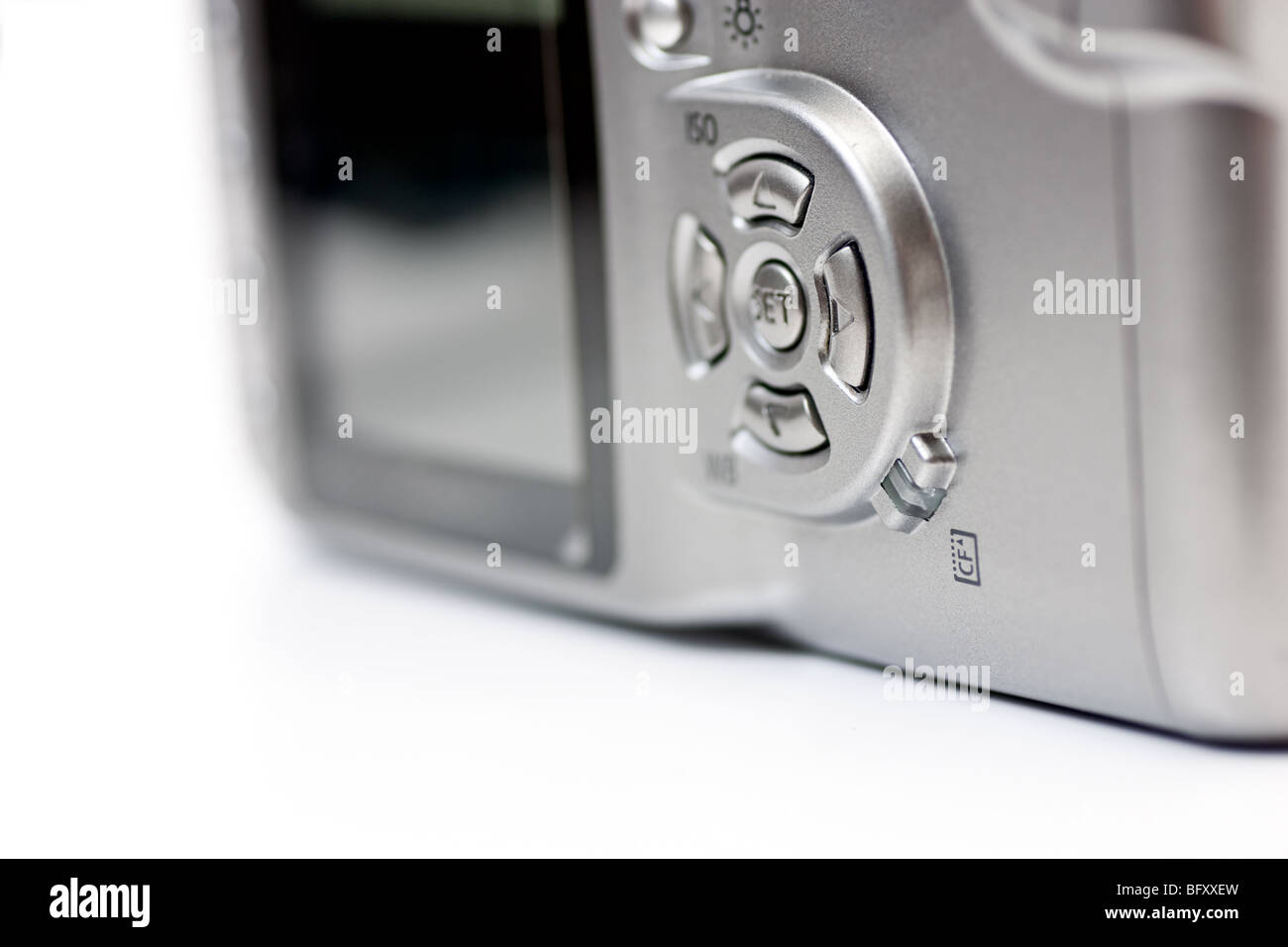 A closeup of the back of a digital SLR camera, focus on the directional ...