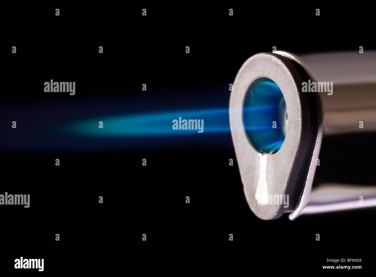 Close up of a burning blue flame from a cooking torch - on a black ...