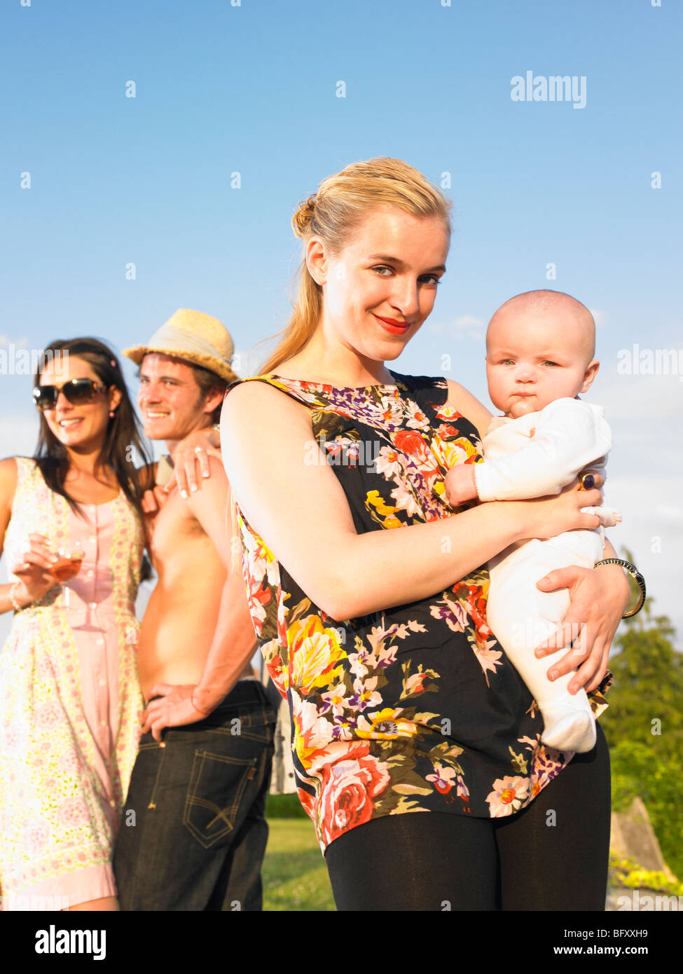 group of young people with baby Stock Photo - Alamy