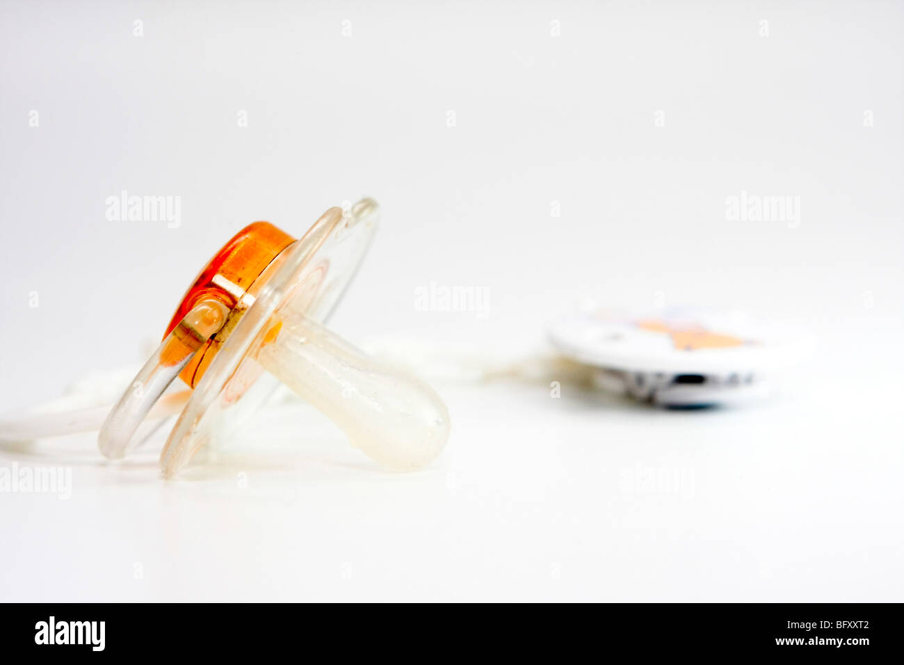 Baby's pacifier on white background Stock Photo - Alamy