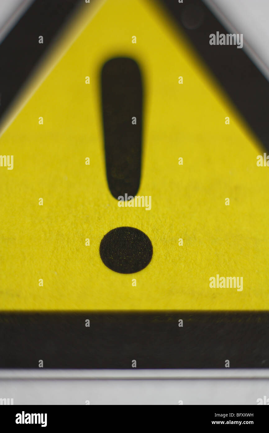 A yellow warning sign Stock Photo - Alamy