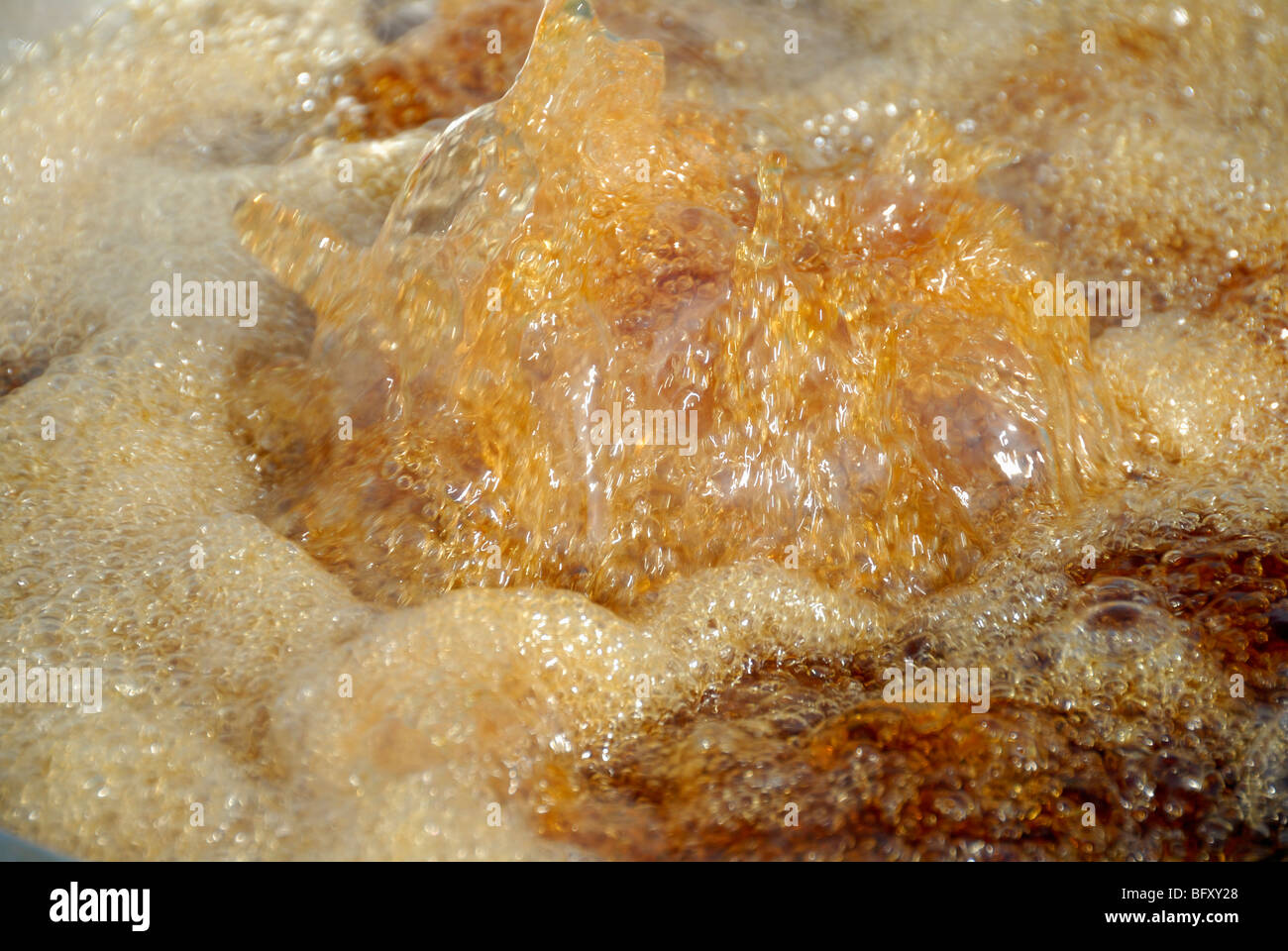 Hot oil for deep frying in a cooker at temperature Stock Photo - Alamy