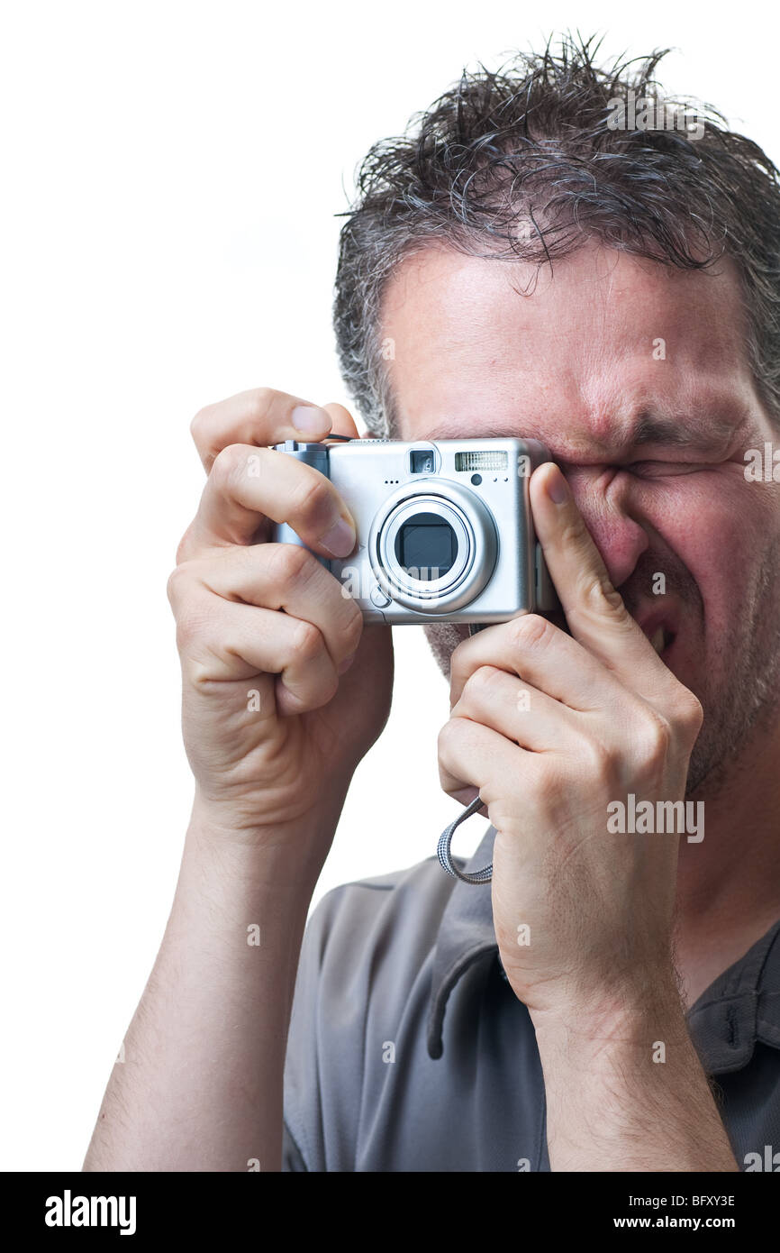 A man shooting with a small digital camera, isolated on white Stock ...