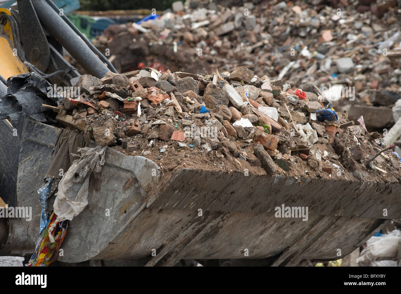 Excavator working at a materials recycling facility in England Stock ...
