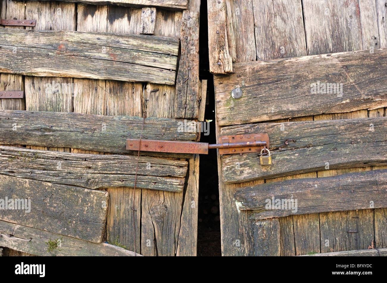 small opening in a wooden door Stock Photo - Alamy