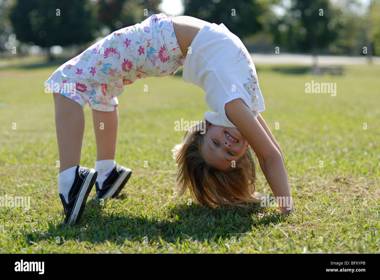 Young girl playing outside Stock Photo - Alamy