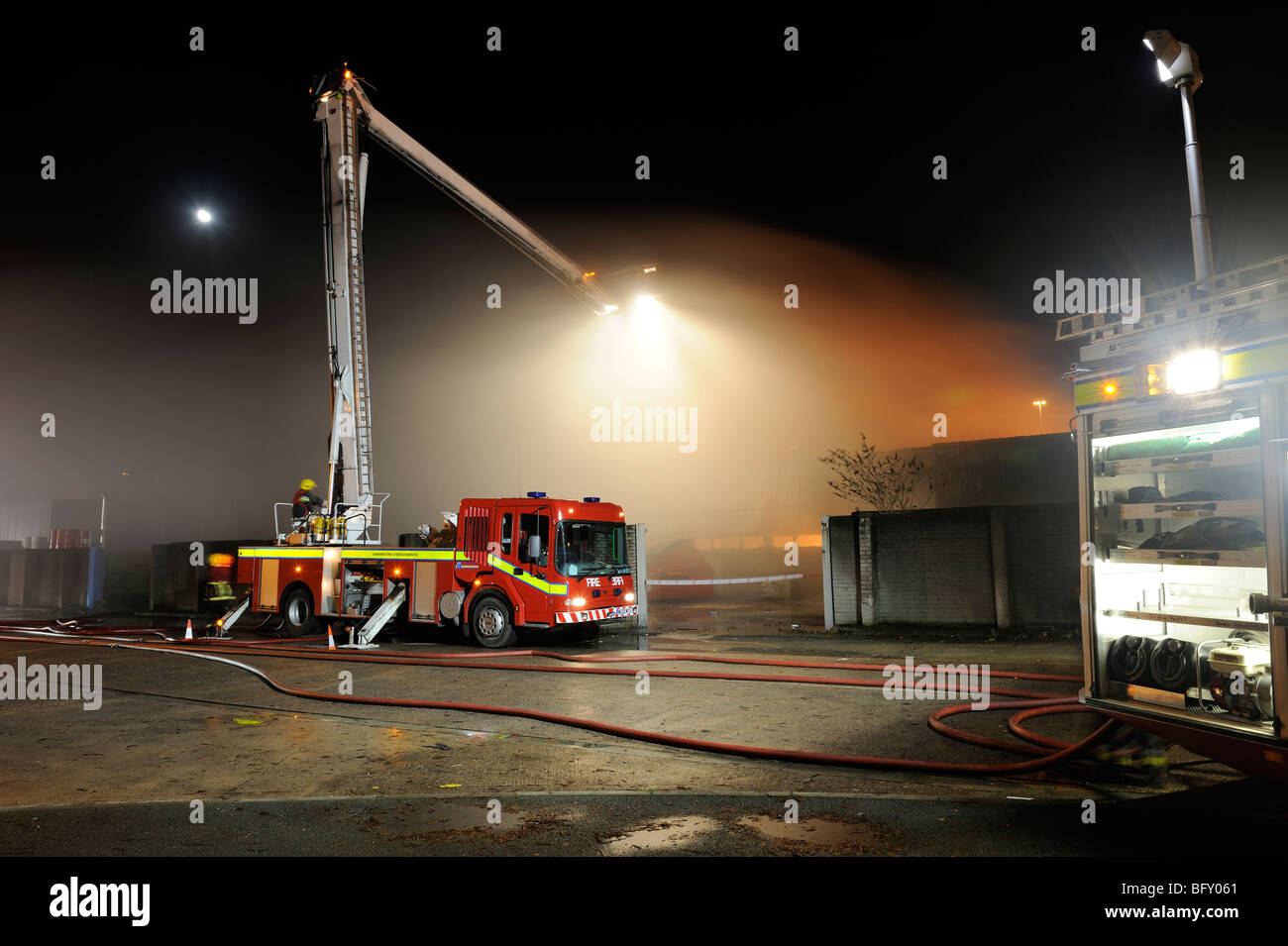 Factory Warehouse on fire at night Stock Photo - Alamy