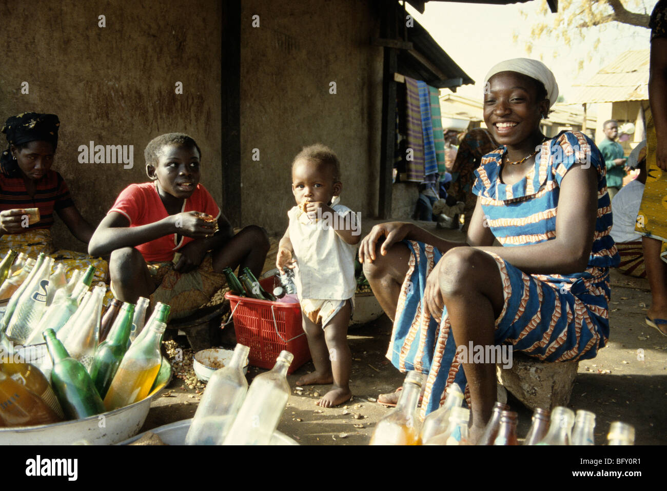 Market trader girl with brother and sister African market Mamie ...