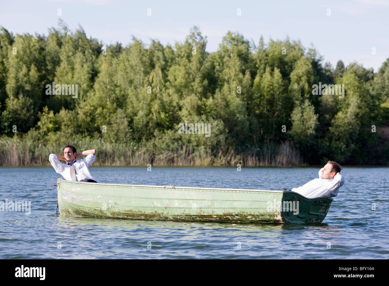 Businessmen in sailing boat hi-res stock photography and images - Alamy