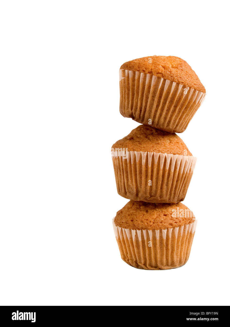 A pile of three muffins isolated over white background Stock Photo - Alamy