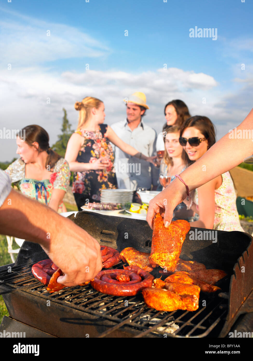 young people having barbecue Stock Photo - Alamy