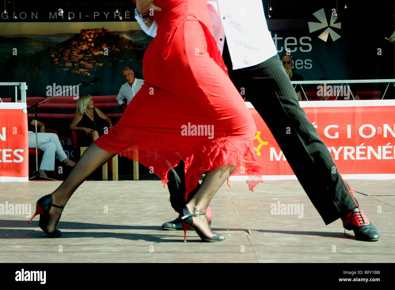 Demonstrating the art of tango dancing on a rough stage at a Gascony ...