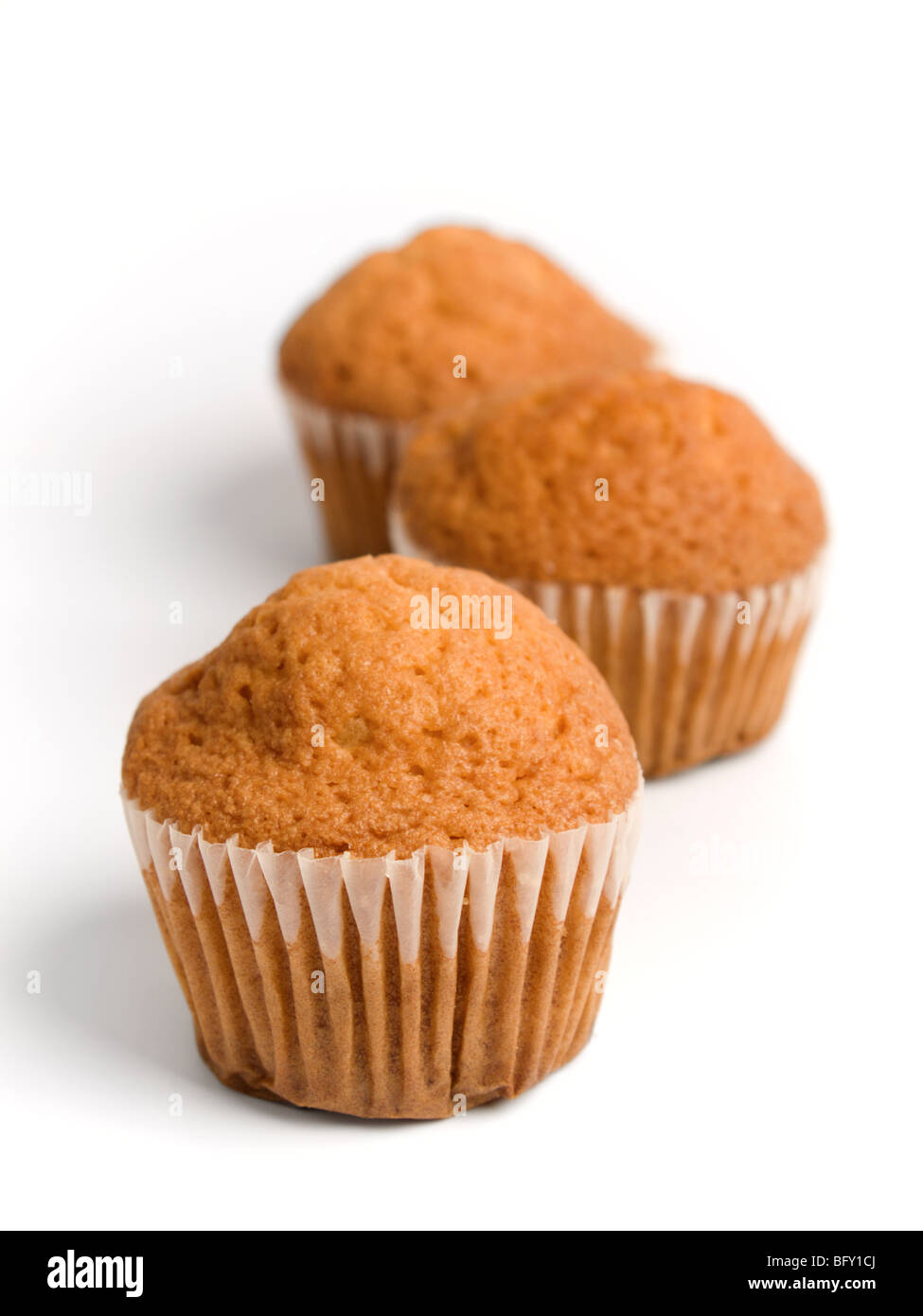 Three muffins over white background Stock Photo - Alamy