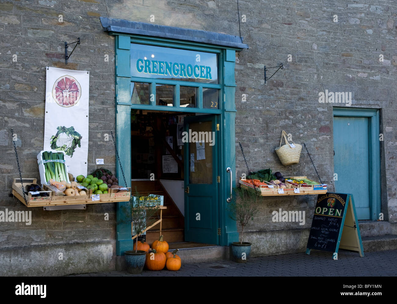 Exterior view of a traditional greengrocer's shop with fruit and ...