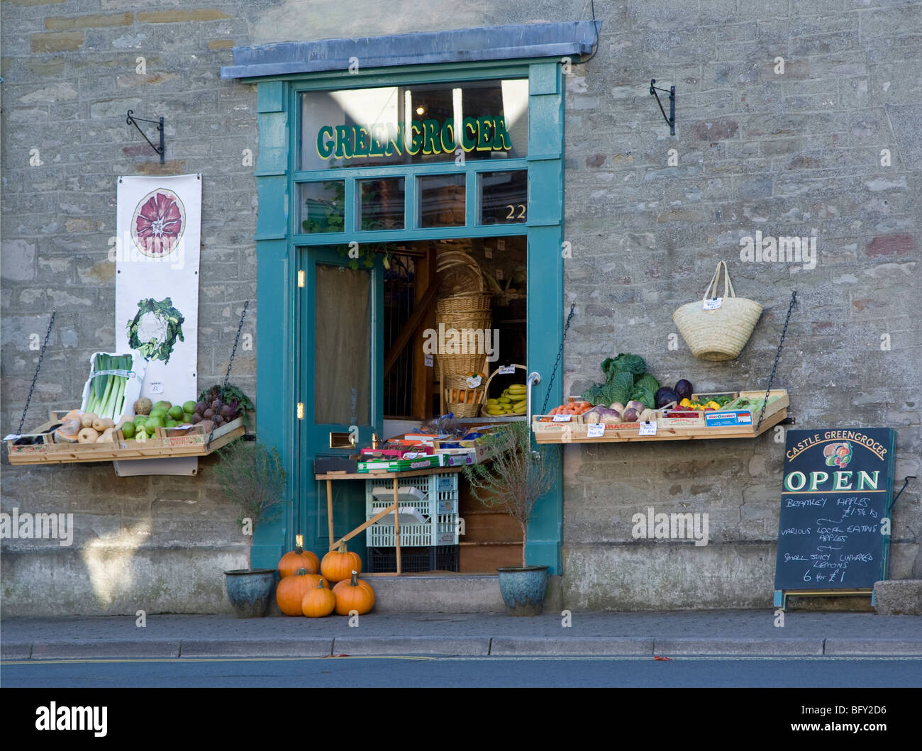 Exterior view of a traditional greengrocer's shop with fruit and ...