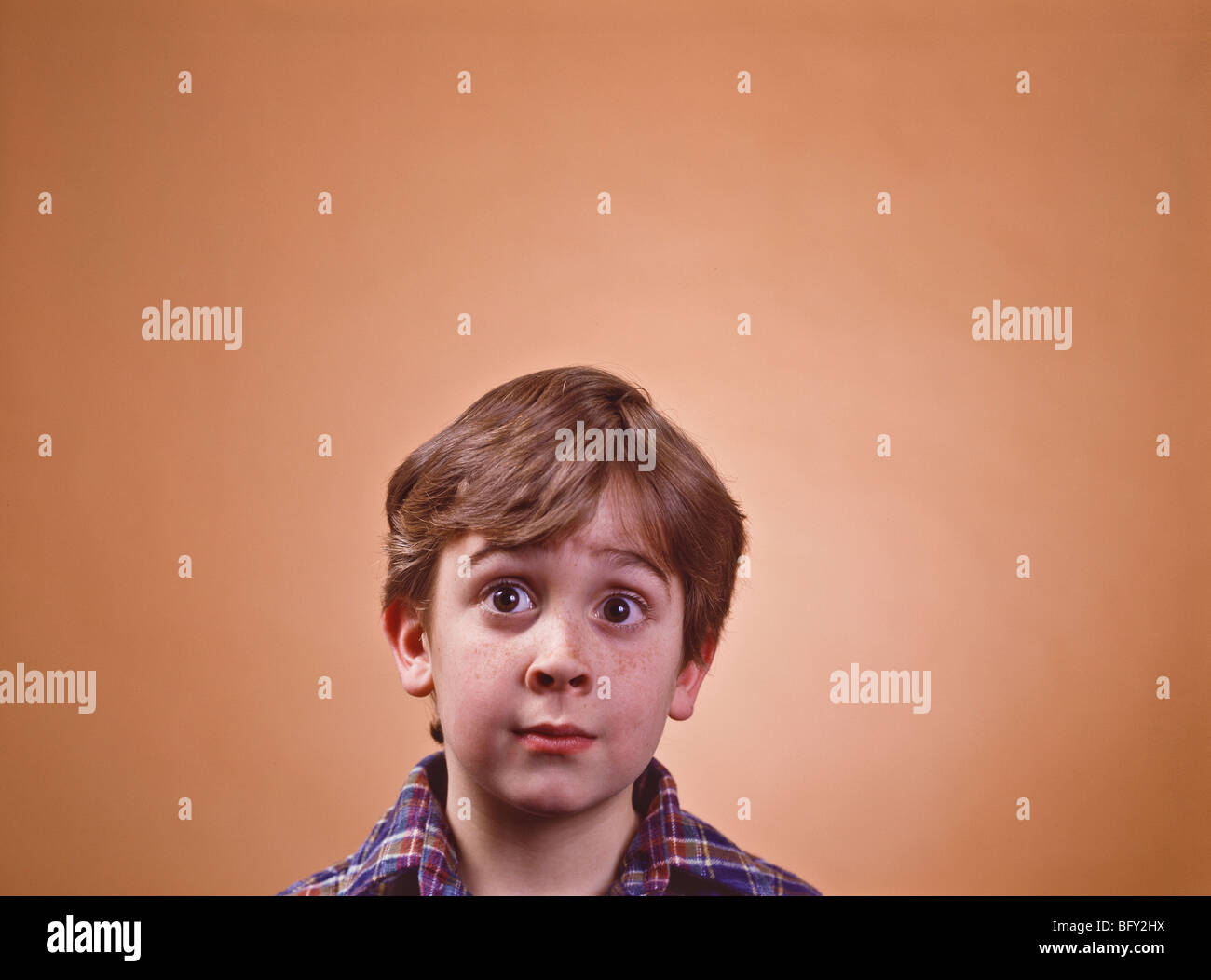 Curious youth looks askew Stock Photo - Alamy