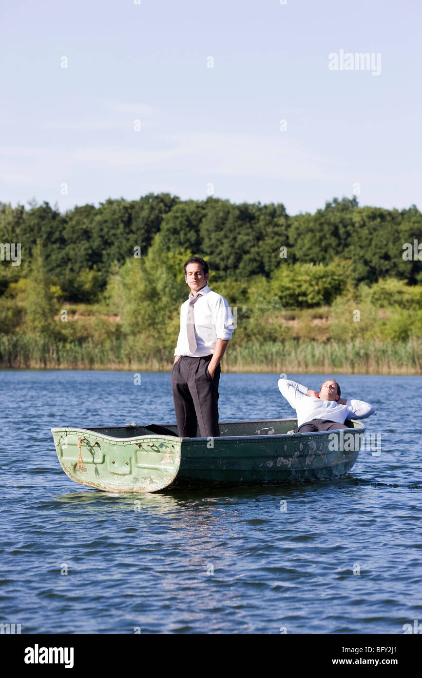 Businessmen in sailing boat hi-res stock photography and images - Alamy