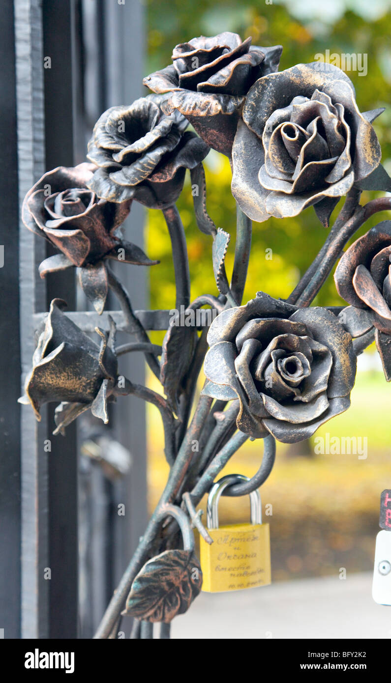 forged rose bouquet and padlock in public "Park of forged figures" in ...