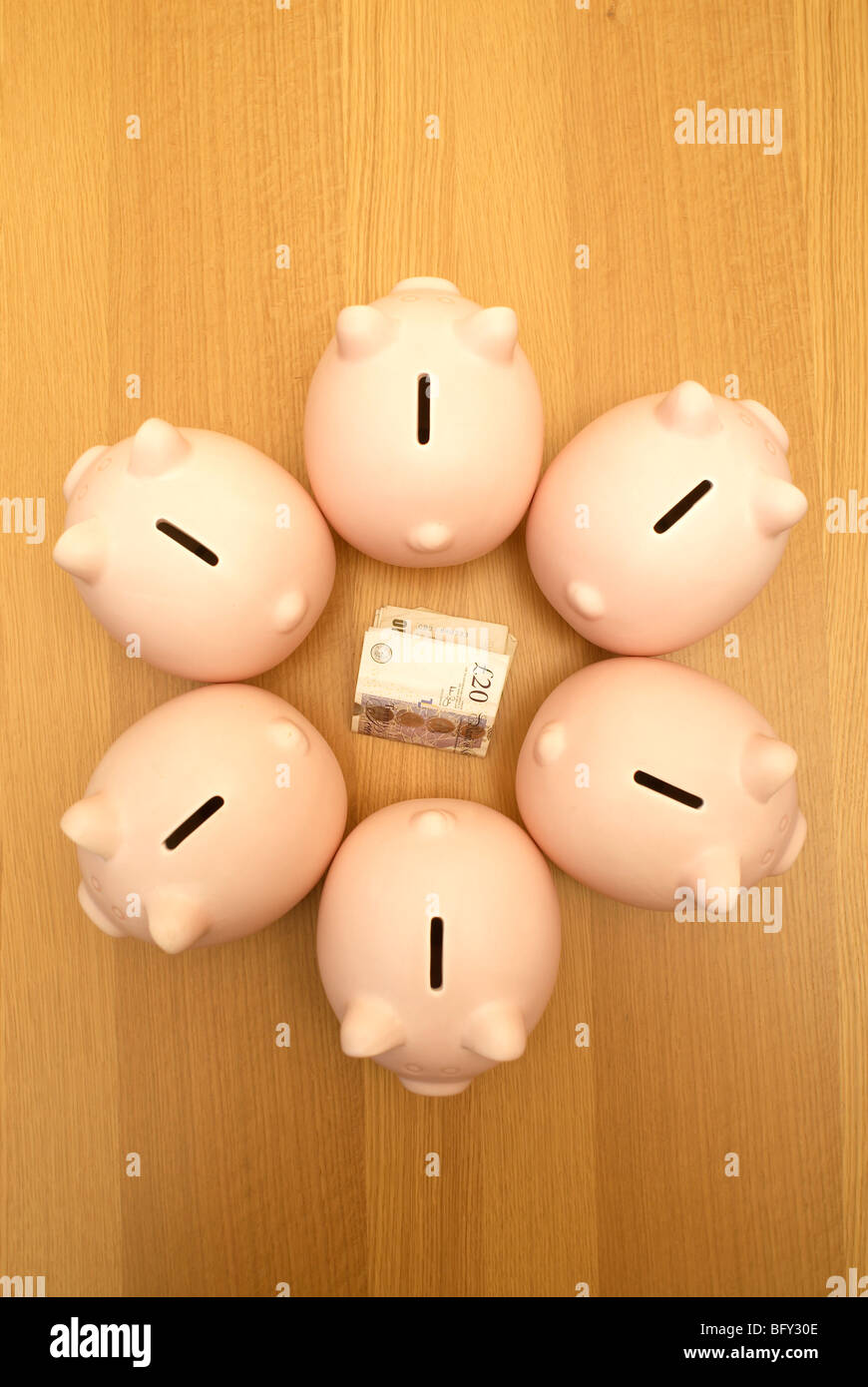piggy banks guarding money Stock Photo - Alamy