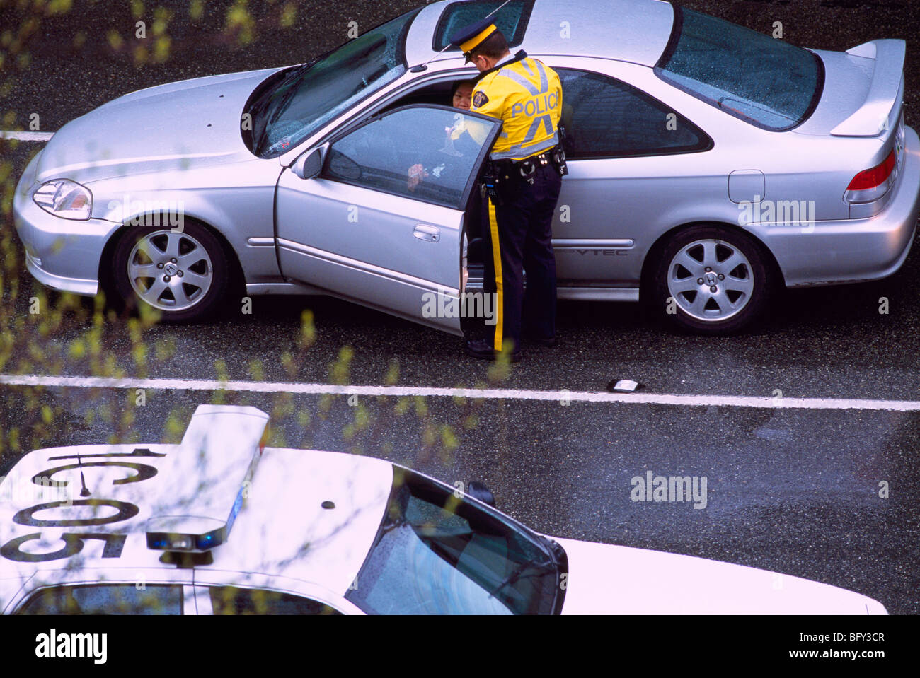 Police Officer writing a Ticket for Traffic Violation Incident to ...