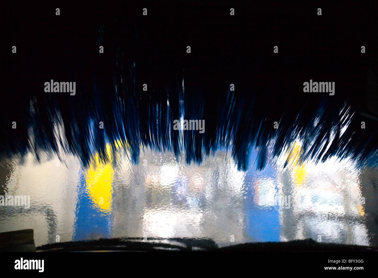 Car in a carwash. View from inside a car as it progresses through an ...