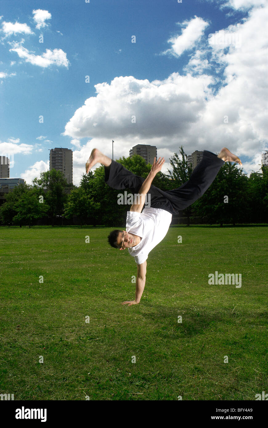 one hand handstand Stock Photo - Alamy