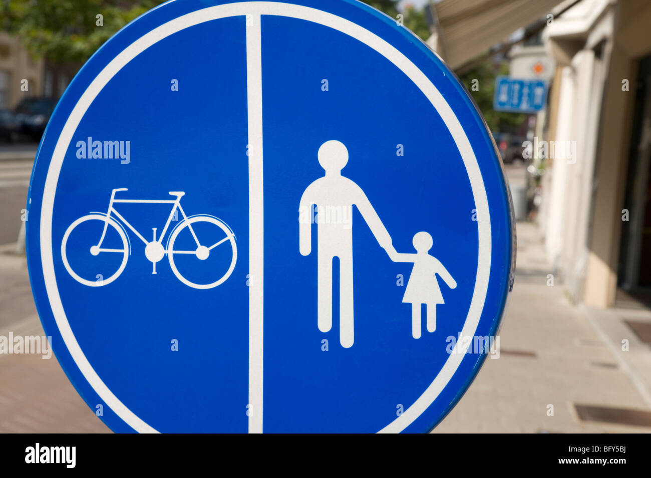 Cycling Blue Sign Stock Photo - Alamy