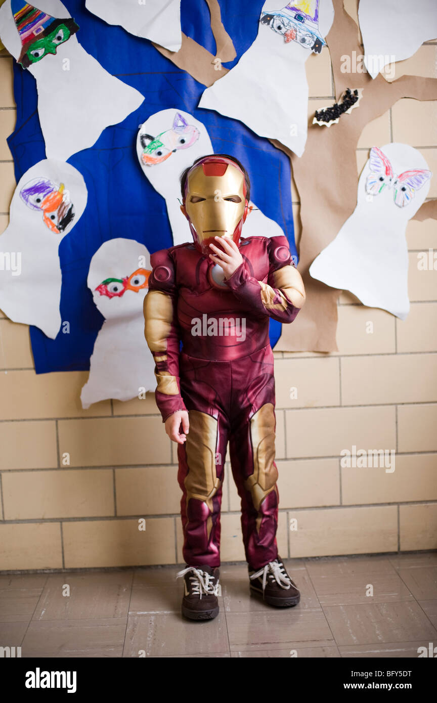 Four year old boy dressed as Marvel Comics Iron Man stands in front of ...
