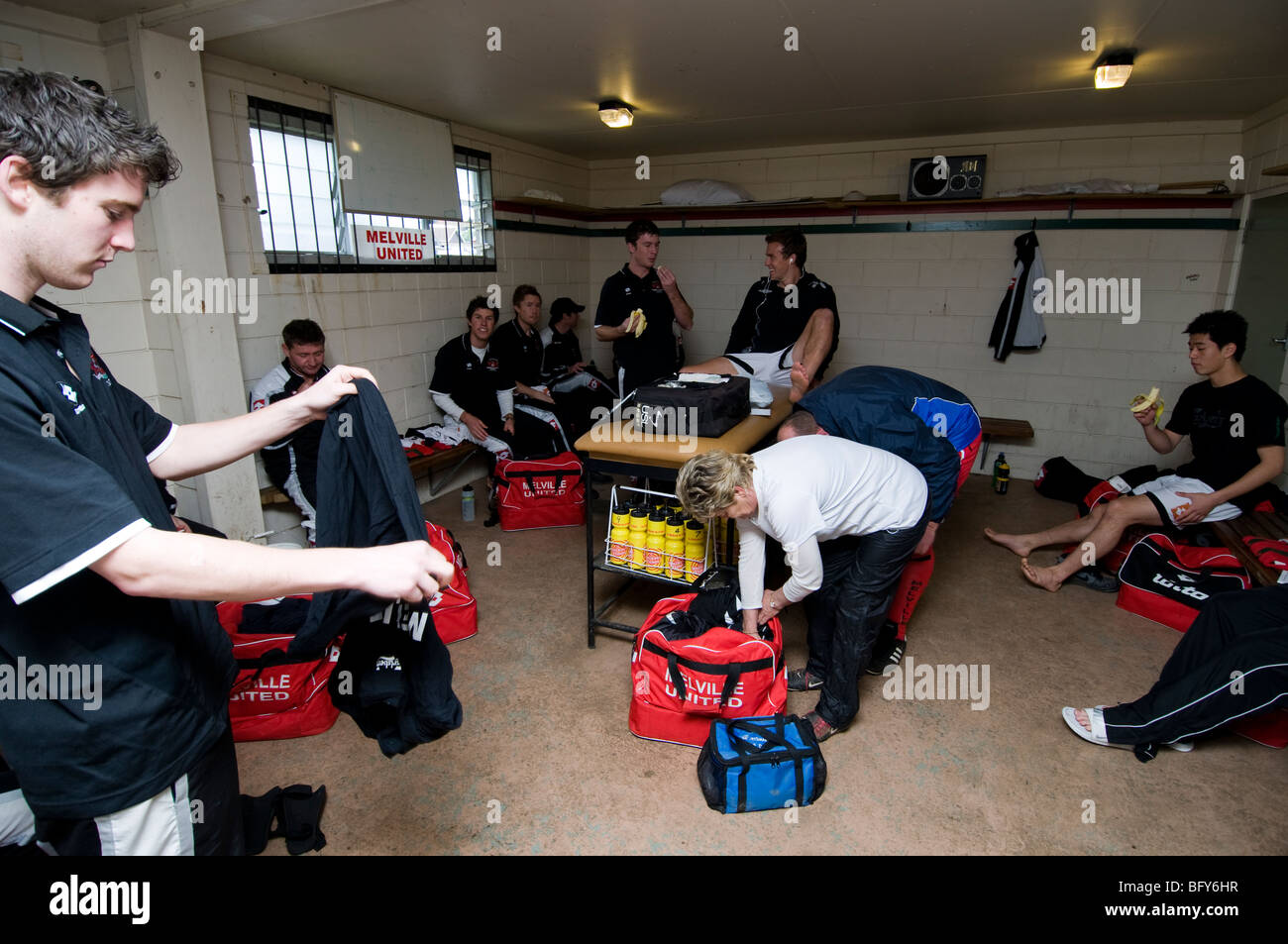 soccer team getting ready in changing room Stock Photo - Alamy