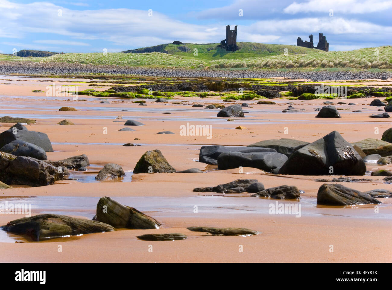 Dunstanburgh Castle seen from Embleston beach Stock Photo - Alamy