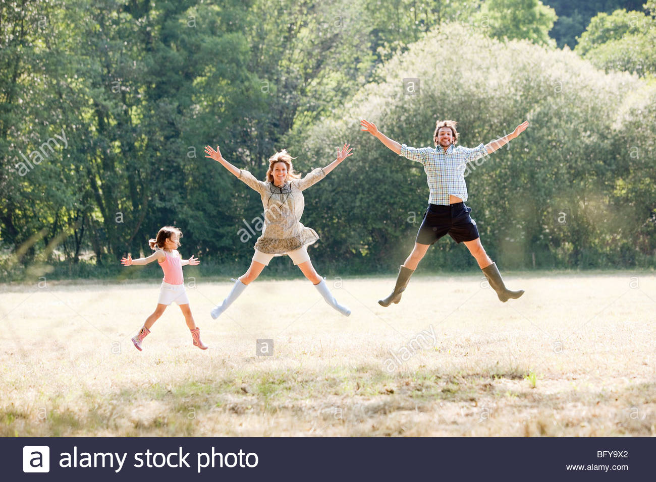 Happy Family Jumping In Air Stock Photos & Happy Family Jumping In Air ...