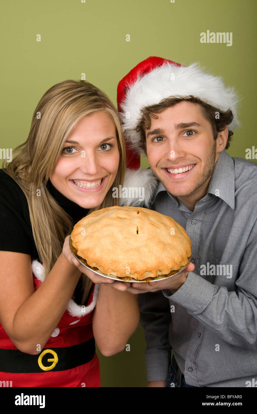 Couple holding pie Stock Photo - Alamy