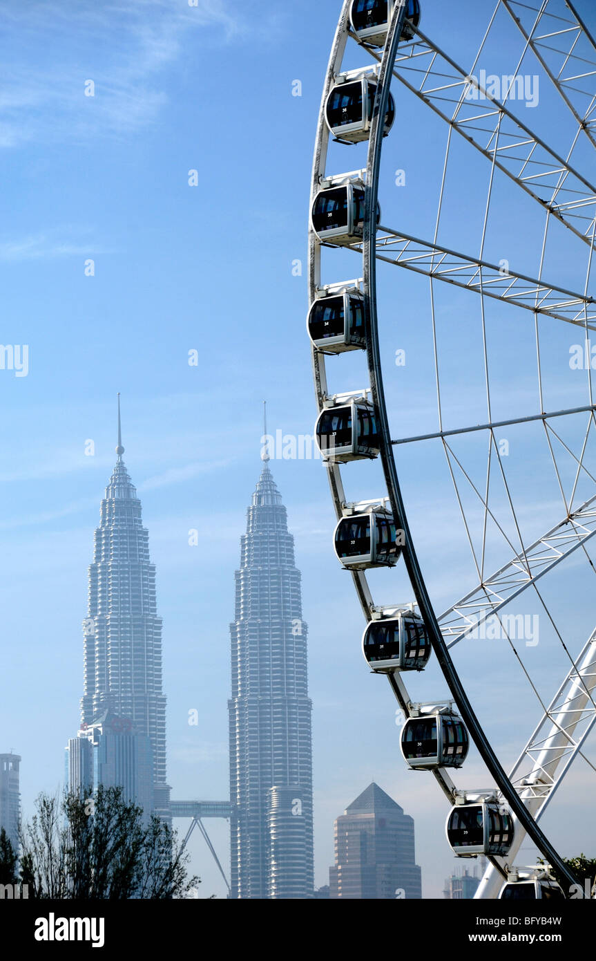 City Skyline with Petronas Towers & Eye on Malaysia Ferris Wheel ...