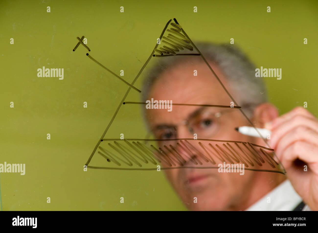 Man drawing triangle Stock Photo - Alamy
