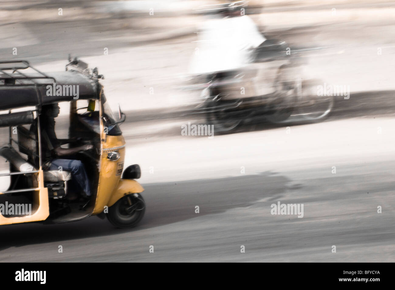 Auto rickshaw moving on road hi-res stock photography and images - Alamy