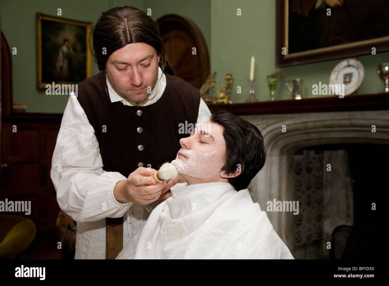 Eighteenth century gentleman receiving shave hi-res stock photography ...
