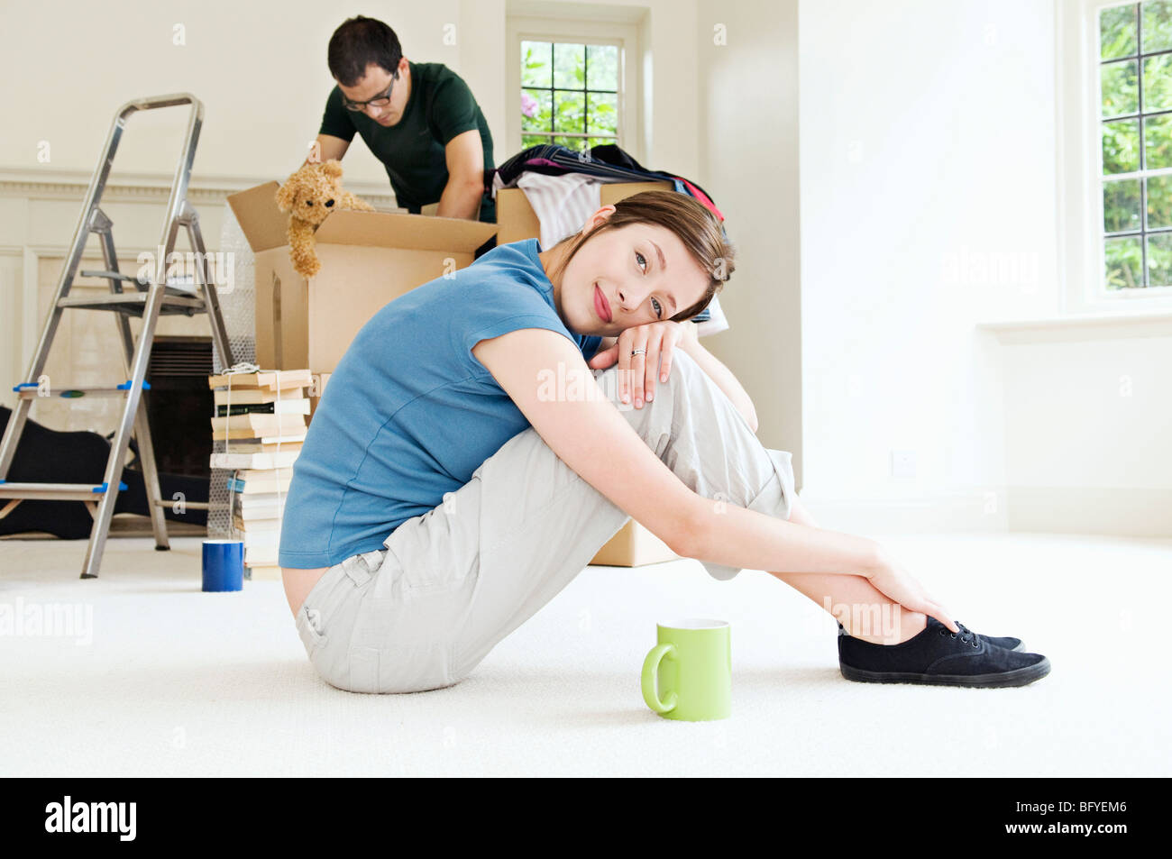 A young female moving house Stock Photo - Alamy