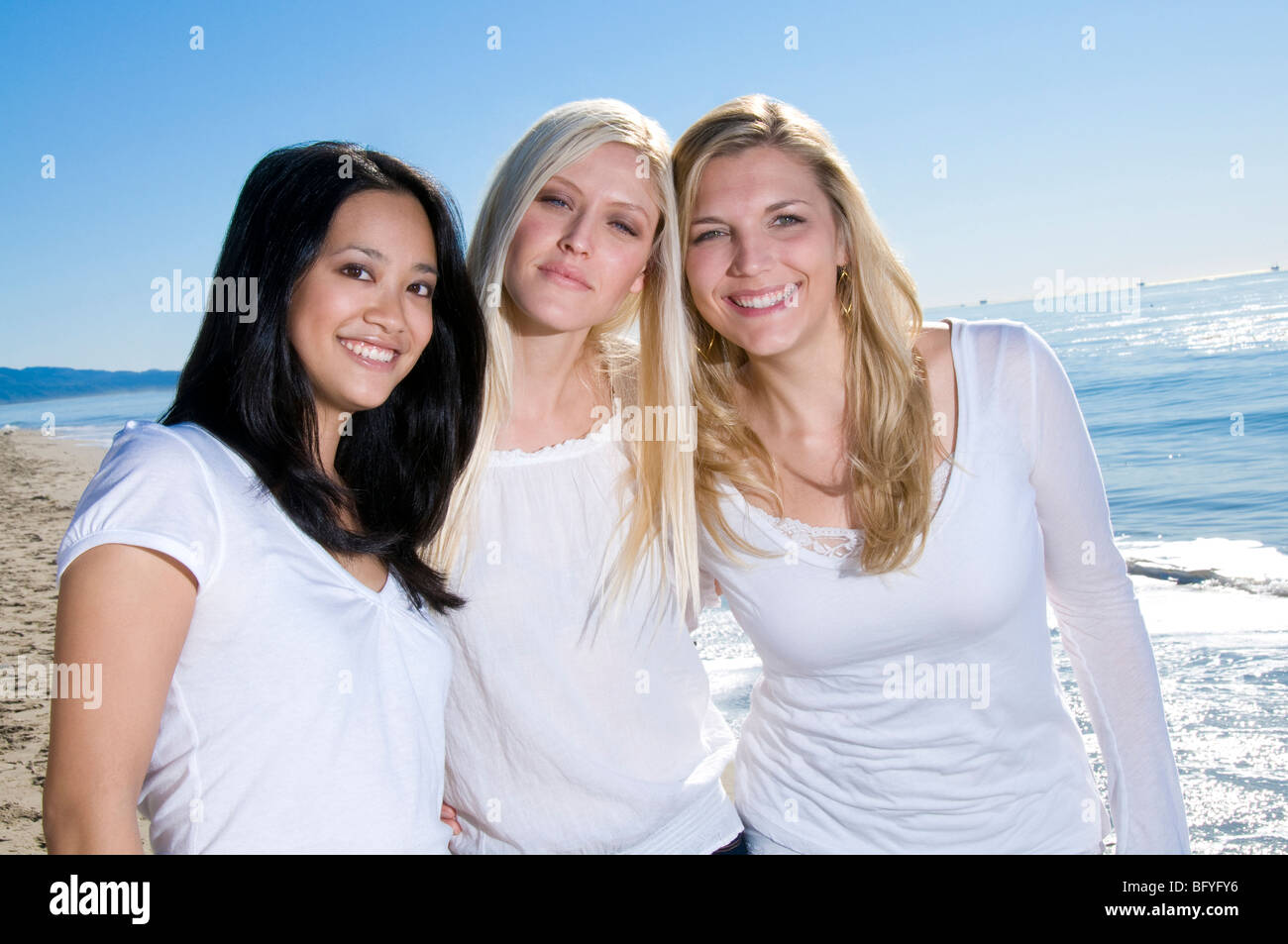 Woman smiling on beach Stock Photo - Alamy