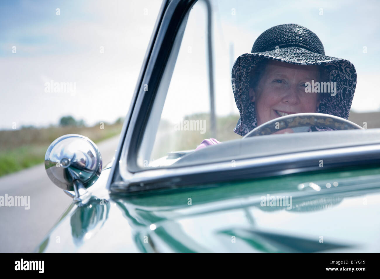Mature lady driving car hi-res stock photography and images - Alamy
