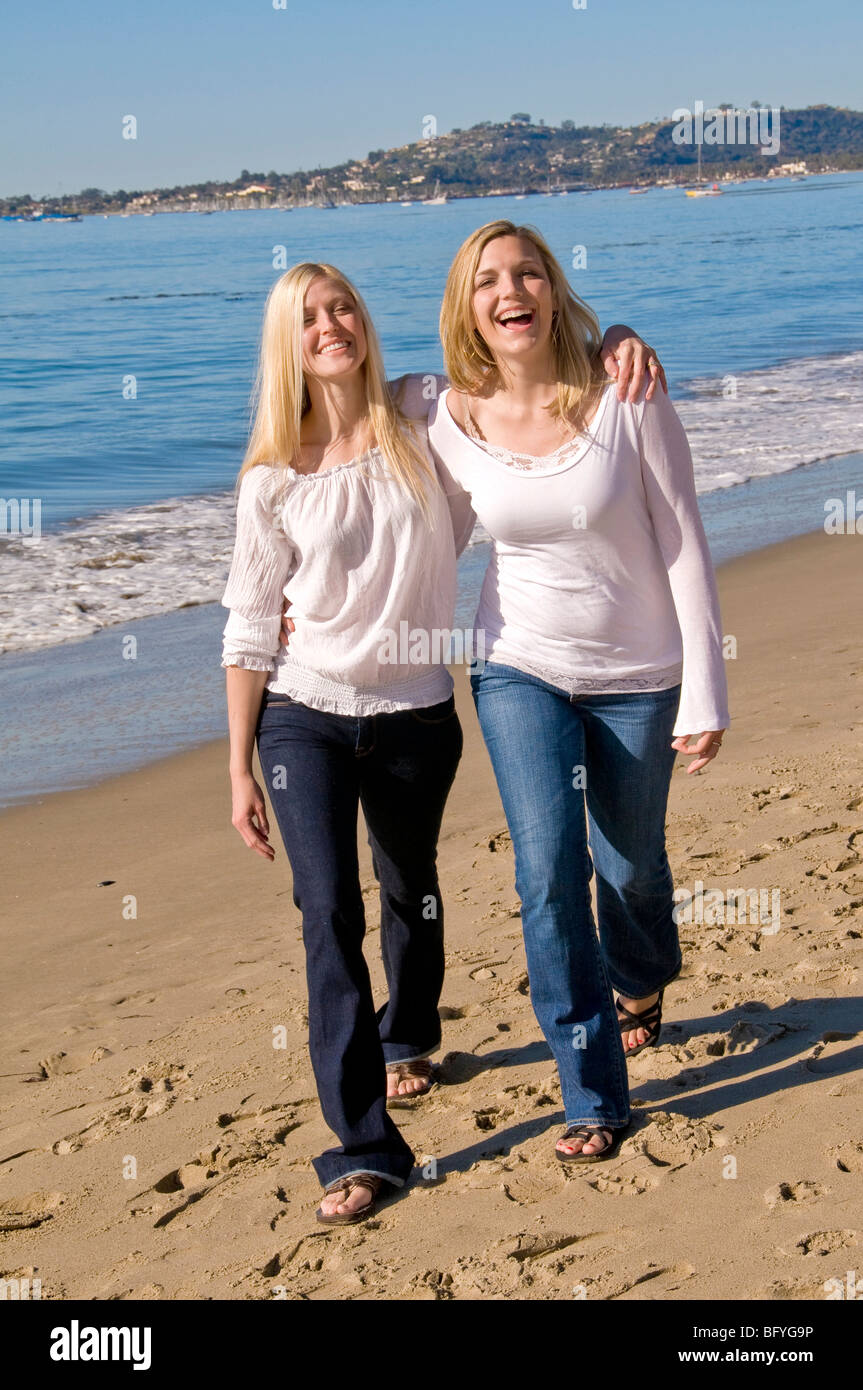 Women walking on beach Stock Photo - Alamy