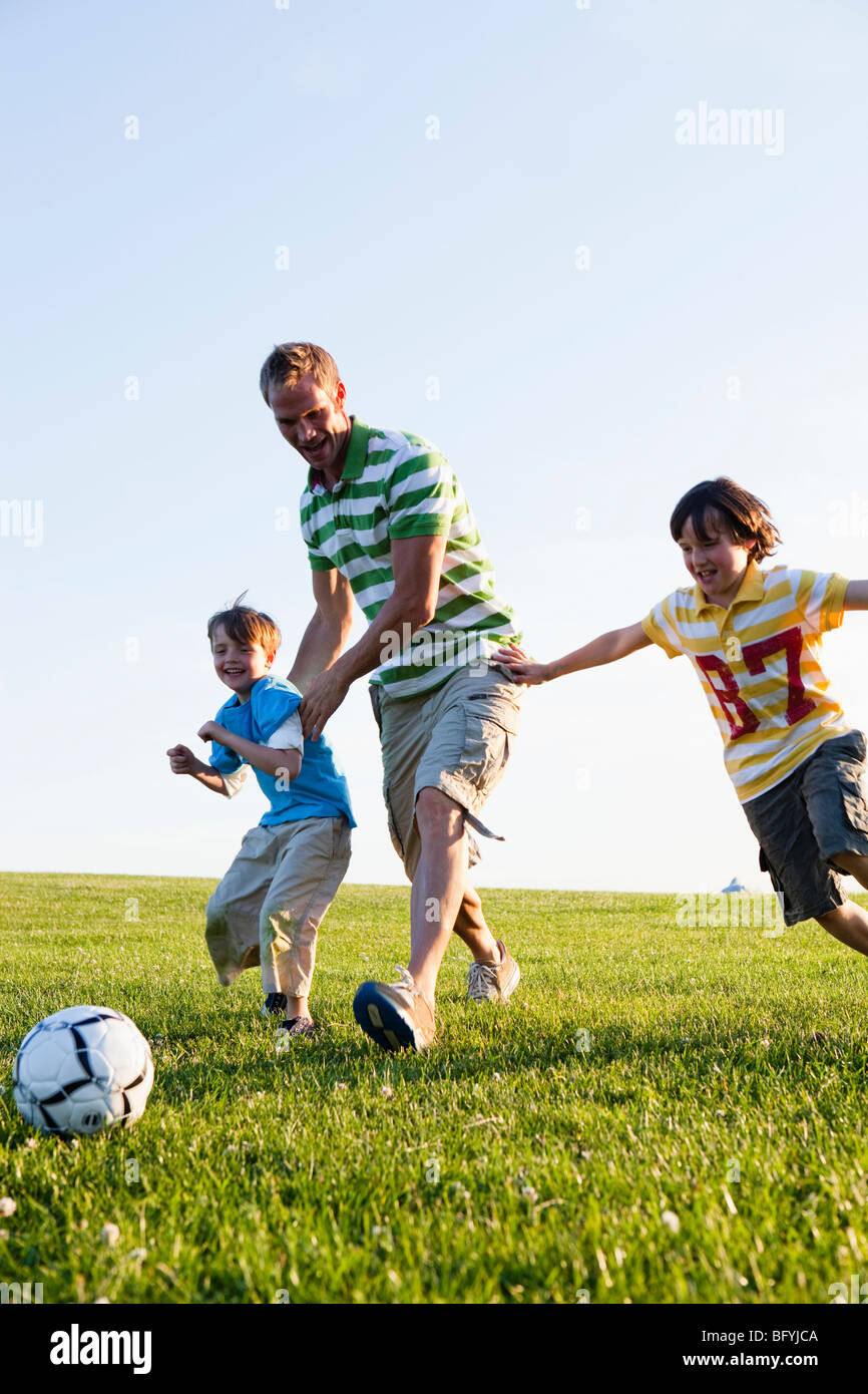 Father Son Playing Soccer Ball Stock Photos & Father Son Playing Soccer ...
