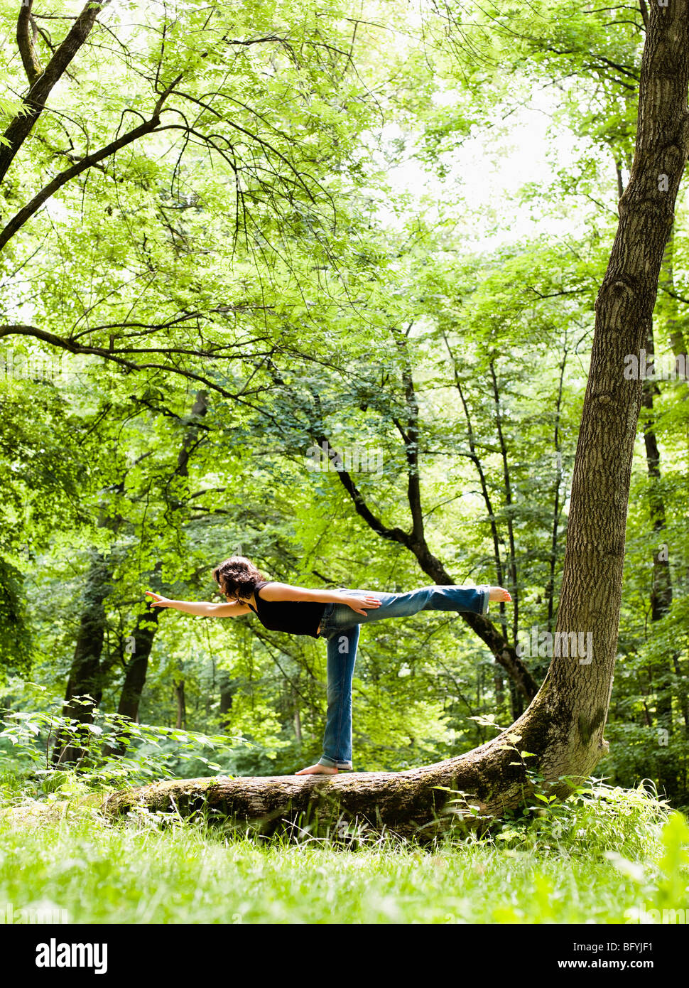 Woman Doing Yoga In The Woods Stock Photo - Alamy