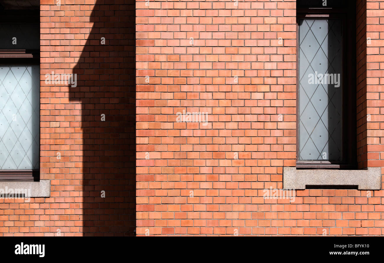 Red brick wall with windows Stock Photo - Alamy